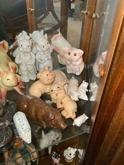 Contents of shelf: pig figurines - Hurley Real Estate & Auctions