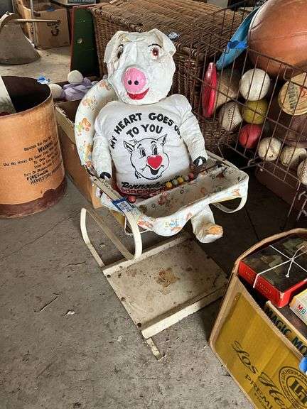 Inflatable pig in vintage baby chair - Hurley Real Estate & Auctions