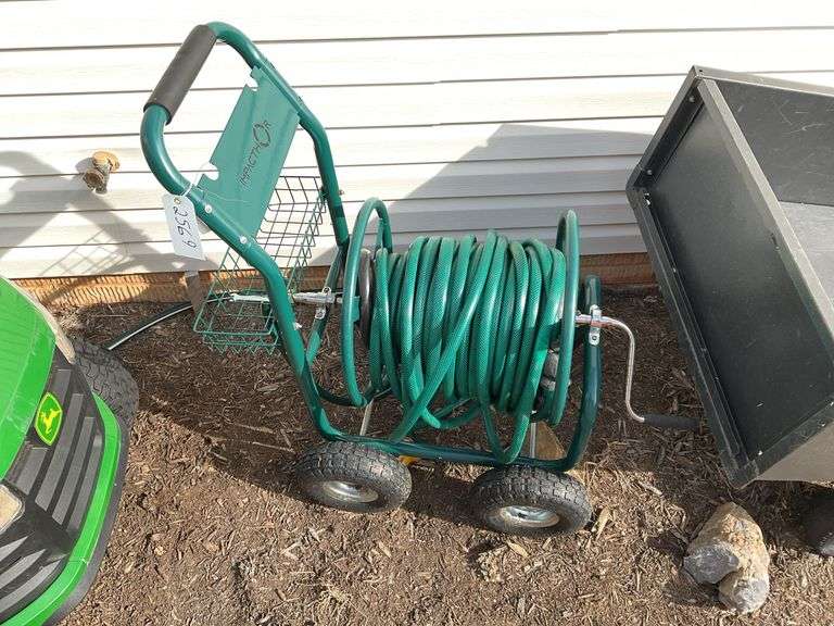 Rolling hose reel w/ hose - Hurley Real Estate & Auctions