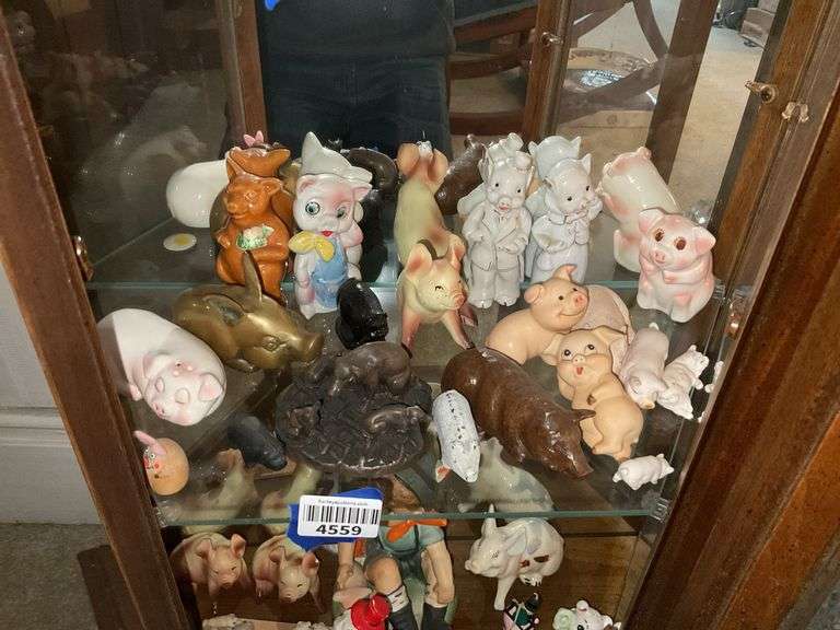 Contents of shelf: pig figurines - Hurley Real Estate & Auctions