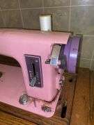 Pink Brother sewing machine in oak treadle cabinet - no top contents ...