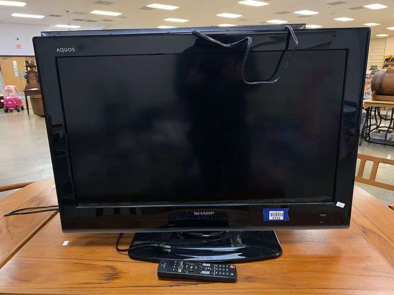 32in Sharp aquos television w/ remote - Hurley Real Estate & Auctions