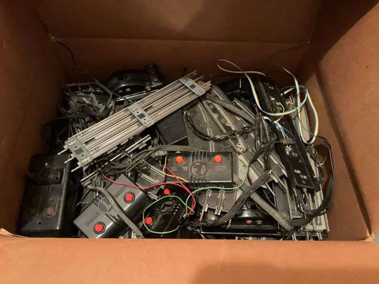 Box of train track and Lionel controllers - Hurley Real Estate & Auctions
