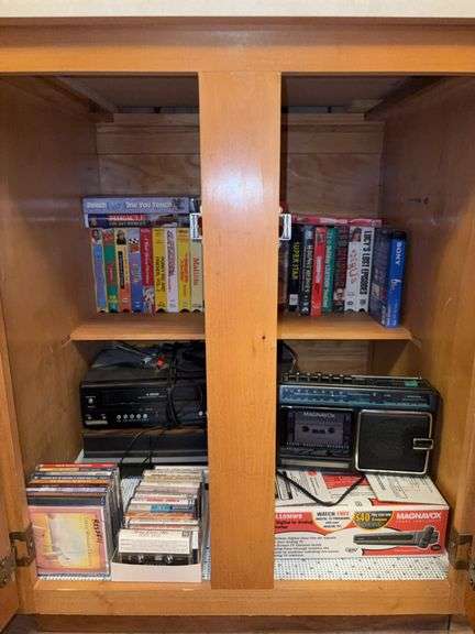 Contents of cupboard - CDs, cassettes, Magnavox VHS Recorder, Magnavox ...