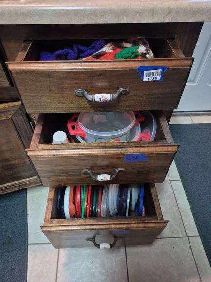 Contents of three drawers: plastic storage containers, hotpads - Hurley ...
