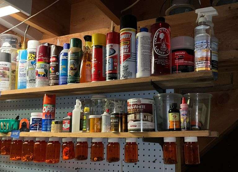 Contents of two shelves: spray paint, lamp oil, hardware, hardware in ...