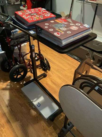 Adjustable rolling patient table - Hurley Real Estate & Auctions
