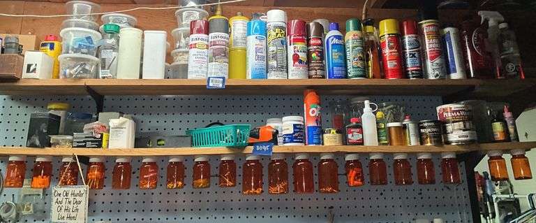 Contents of two shelves: spray paint, lamp oil, hardware, hardware in ...