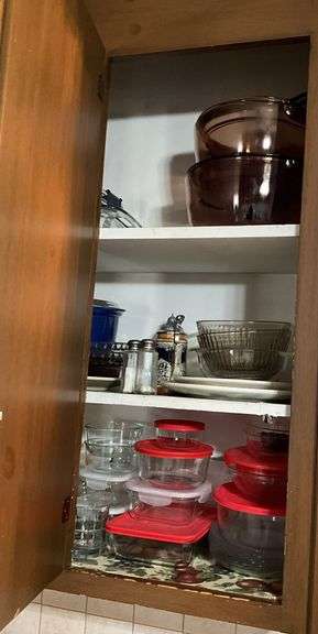 Contents of cupboard: Visions cookware, Pyrex storage, measuring cups ...