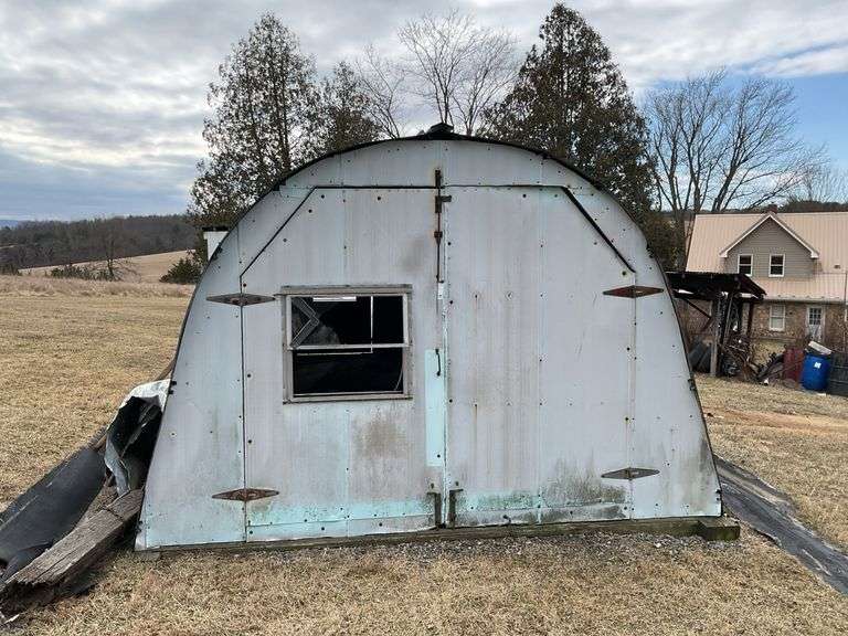 Metal Quonset hut outbuilding. 24 ft x 10 ft, To be removed by buyer ...