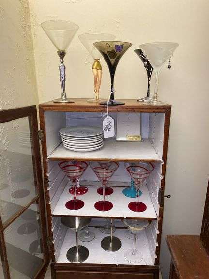 Contents only of cabinet: fancy bar glasses, cocktail plates ...