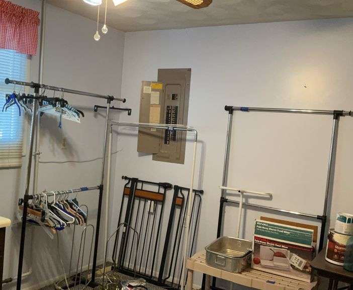 Garment racks, pet gate, clothes hangers - Hurley Real Estate & Auctions