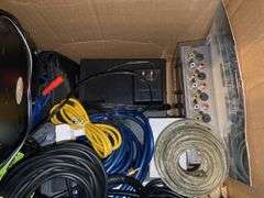 Contents of shelf: electronic cables, power strip, extension cords ...