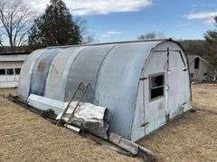 Metal Quonset hut outbuilding. 24 ft x 10 ft, To be removed by buyer ...