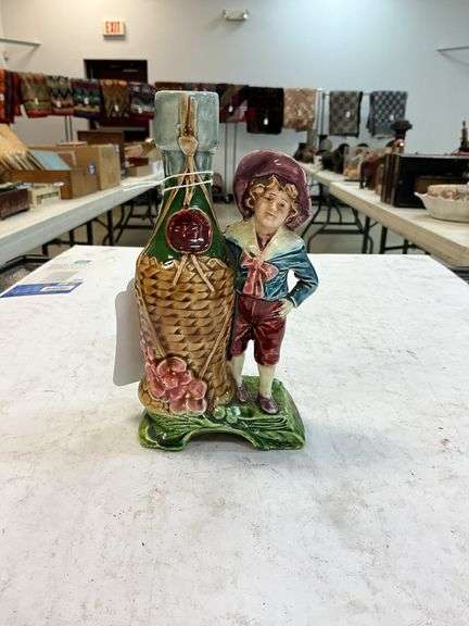Figural majolica candlestick: boy w/ wine bottle - Hurley Real Estate ...
