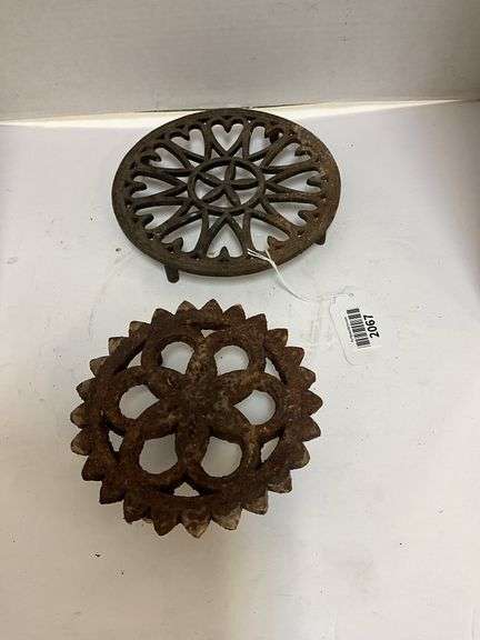 Two cast iron trivets - Hurley Real Estate & Auctions