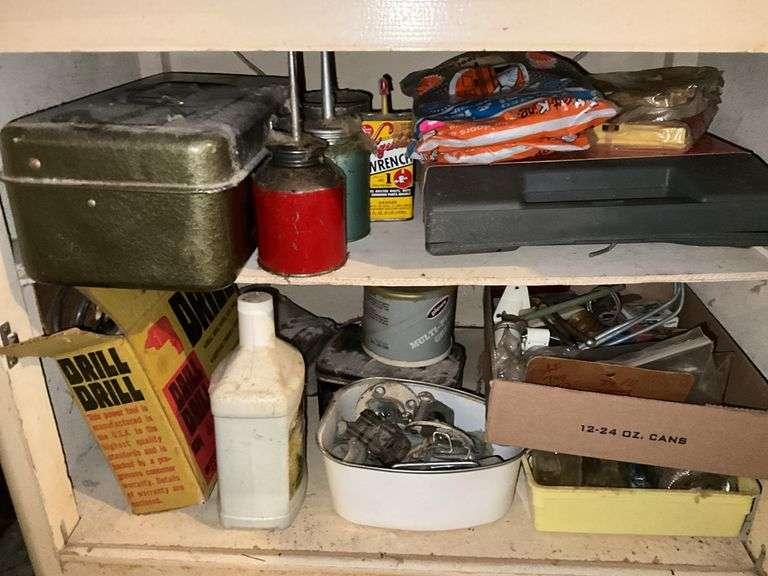 Contents of cupboard: oil cans, toolbox, misc - Hurley Real Estate ...