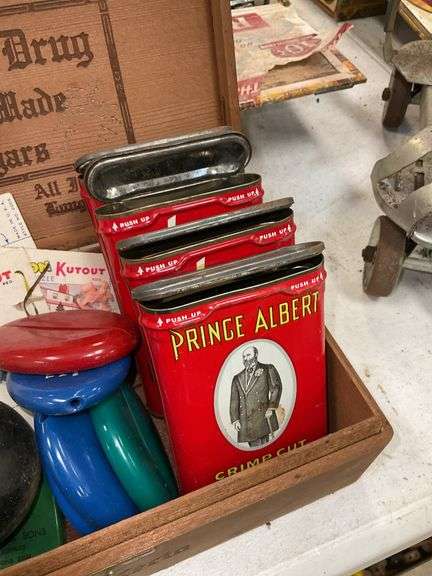 Cigar box and contents: Prince Albert tobacco tins, paper toys, coin ...