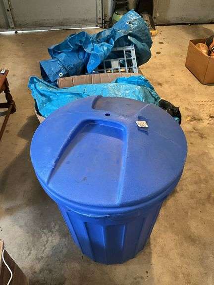 Plastic garbage can and tarps - Hurley Real Estate & Auctions