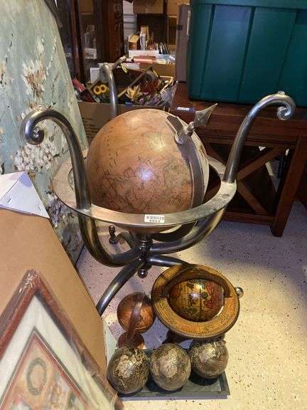 World globe on floor stand, two table globes, three globe spheres on ...