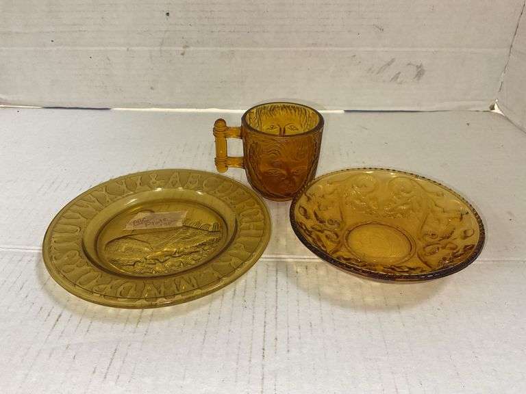 Three pcs amber pressed glass: ABC plate, child's mug, acorn bowl ...