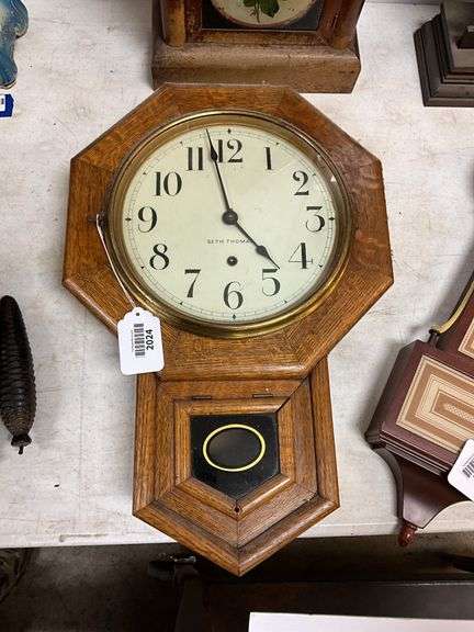 Seth Thomas oak octagon drop wall clock - Hurley Real Estate & Auctions