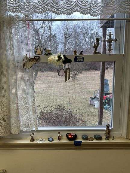 Stained glass trinkets, figurines, paperweights in window - Hurley Real ...
