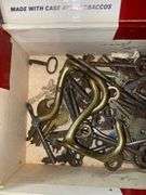 Cigar box of skeleton and other keys, metal coat hooks, Gillette razor ...