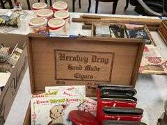 Cigar box and contents: Prince Albert tobacco tins, paper toys, coin ...
