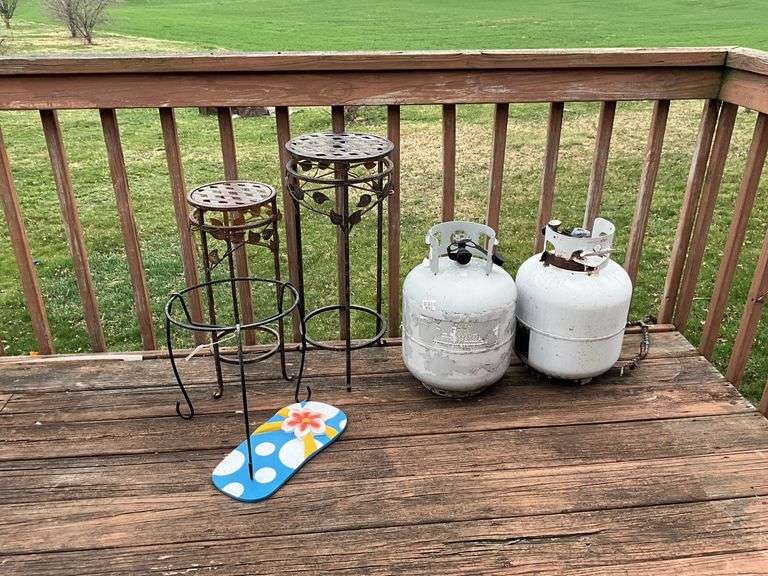 Two propane tanks, metal plant stands, flip-flop decor - Hurley Real ...