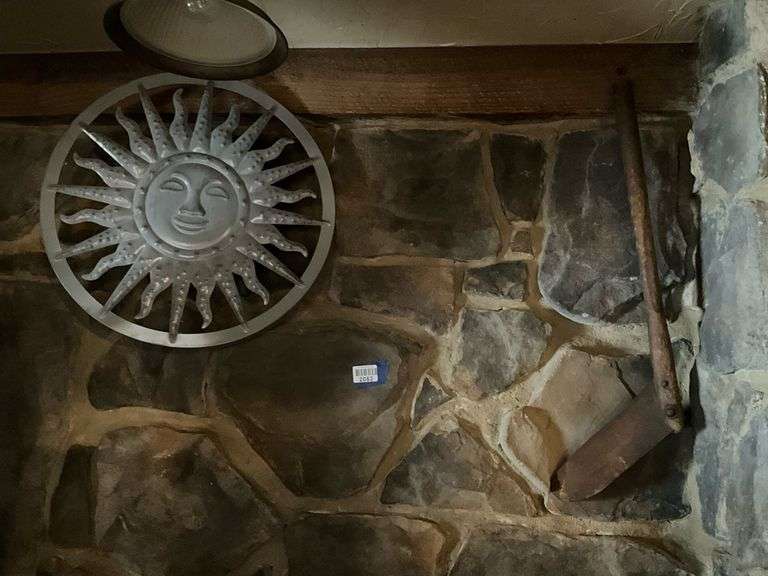 Metal sunburst decor, antique corn chopper - Hurley Real Estate & Auctions