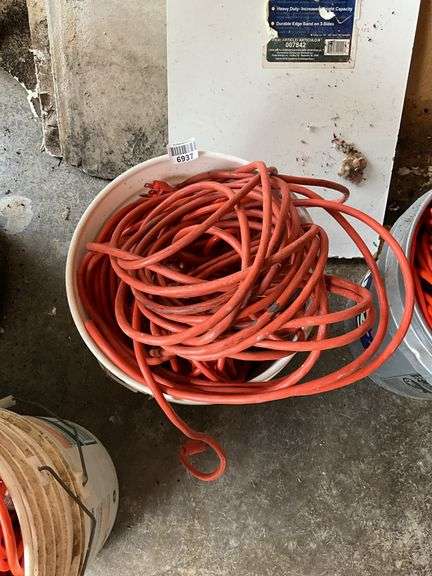 Heavy duty extension cords in bucket - Hurley Real Estate & Auctions