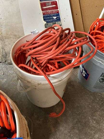 Heavy duty extension cords in bucket - Hurley Real Estate & Auctions