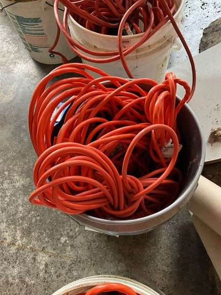 Heavy duty extension cords in bucket - Hurley Real Estate & Auctions