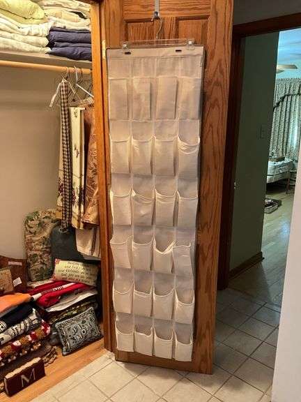 Contents of hall closet - bedding, afghans, throw pillows, tablecloths ...