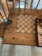 Country checkerboard table and two stools, w/ tray and apple contents ...
