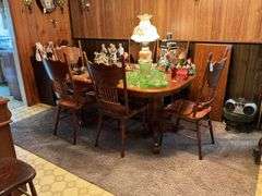 Oak dining table w/ six press back chairs, one leaf, no contents 60”x42 ...