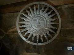 Metal sunburst decor, antique corn chopper - Hurley Real Estate & Auctions