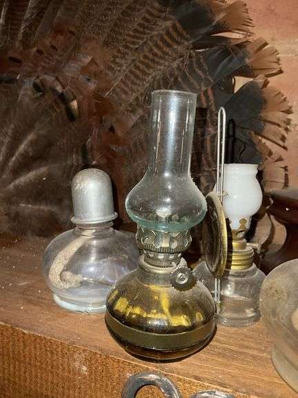 Two miniature oil lamps, two alcohol lamps, pair candleholders w ...