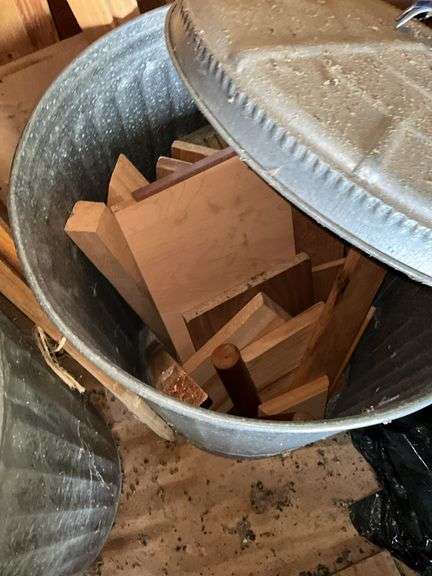 Two galvanized garbage cans w/ wood contents - Hurley Real Estate & Auctions