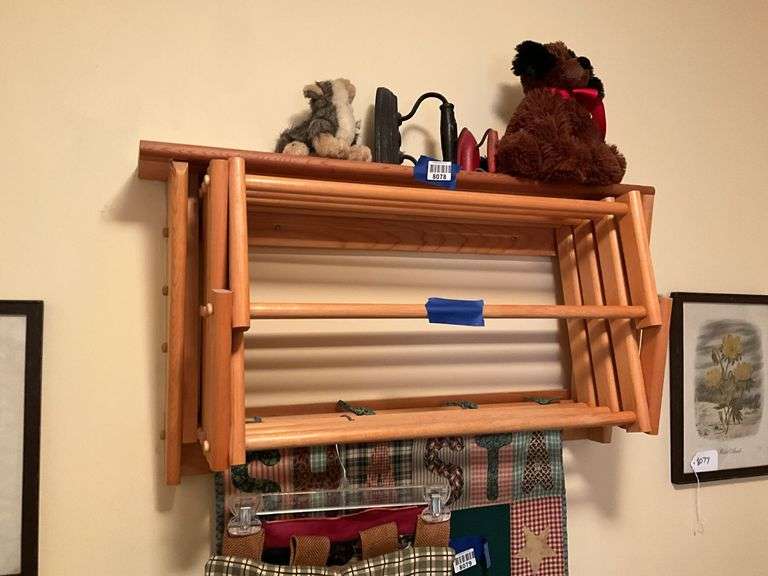 Expanding wall mount drying rack and top contents: sad iron, toy iron ...