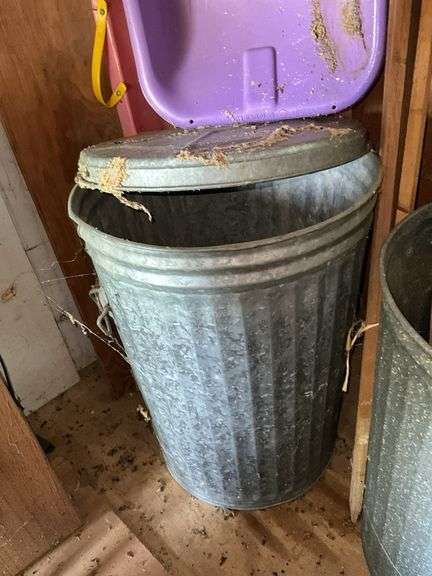 Two galvanized garbage cans w/ wood contents - Hurley Real Estate & Auctions