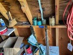 Items on right wall: extension cord, hardware, oil cans, pole pruner ...