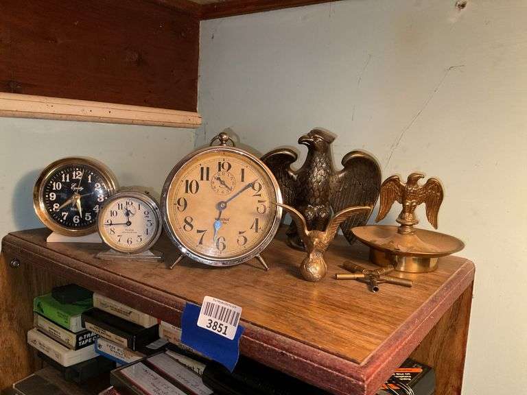 Three vintage alarm clocks, American eagle ashtray and figurines, multi ...