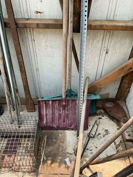 Snow shovels, digging iron, and garden tools along wall - Hurley Real ...