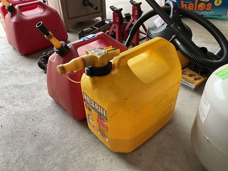 Two fuel cans - one half full, other full - Hurley Real Estate & Auctions