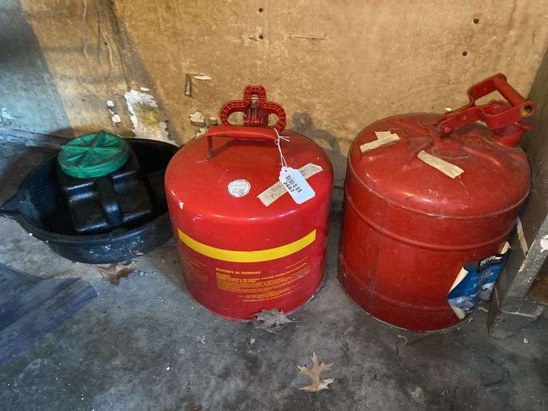 Two metal fuel cans: 1st can full, 2nd can partially full, and oil drain pan - Hurley Real ...