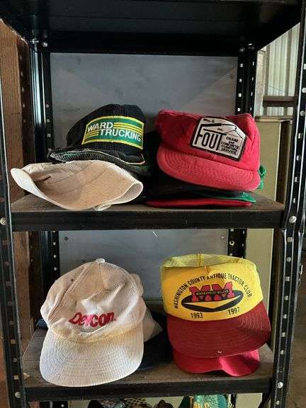 Contents of shelf unit: cap collection, Tall Cedars hat, suspenders ...
