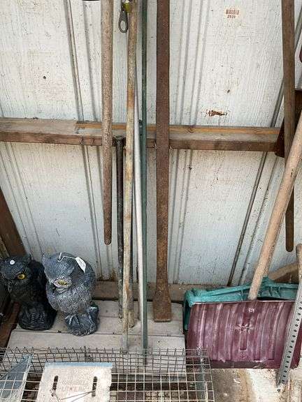 Snow shovels, digging iron, and garden tools along wall - Hurley Real ...