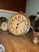 Three vintage alarm clocks, American eagle ashtray and figurines, multi ...